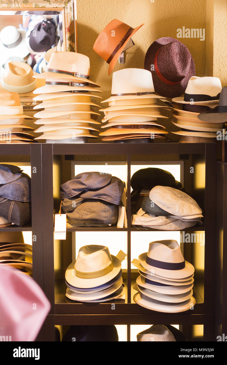 Nice sun hats hanging on the shelf in the shopping store Stock Photo ...