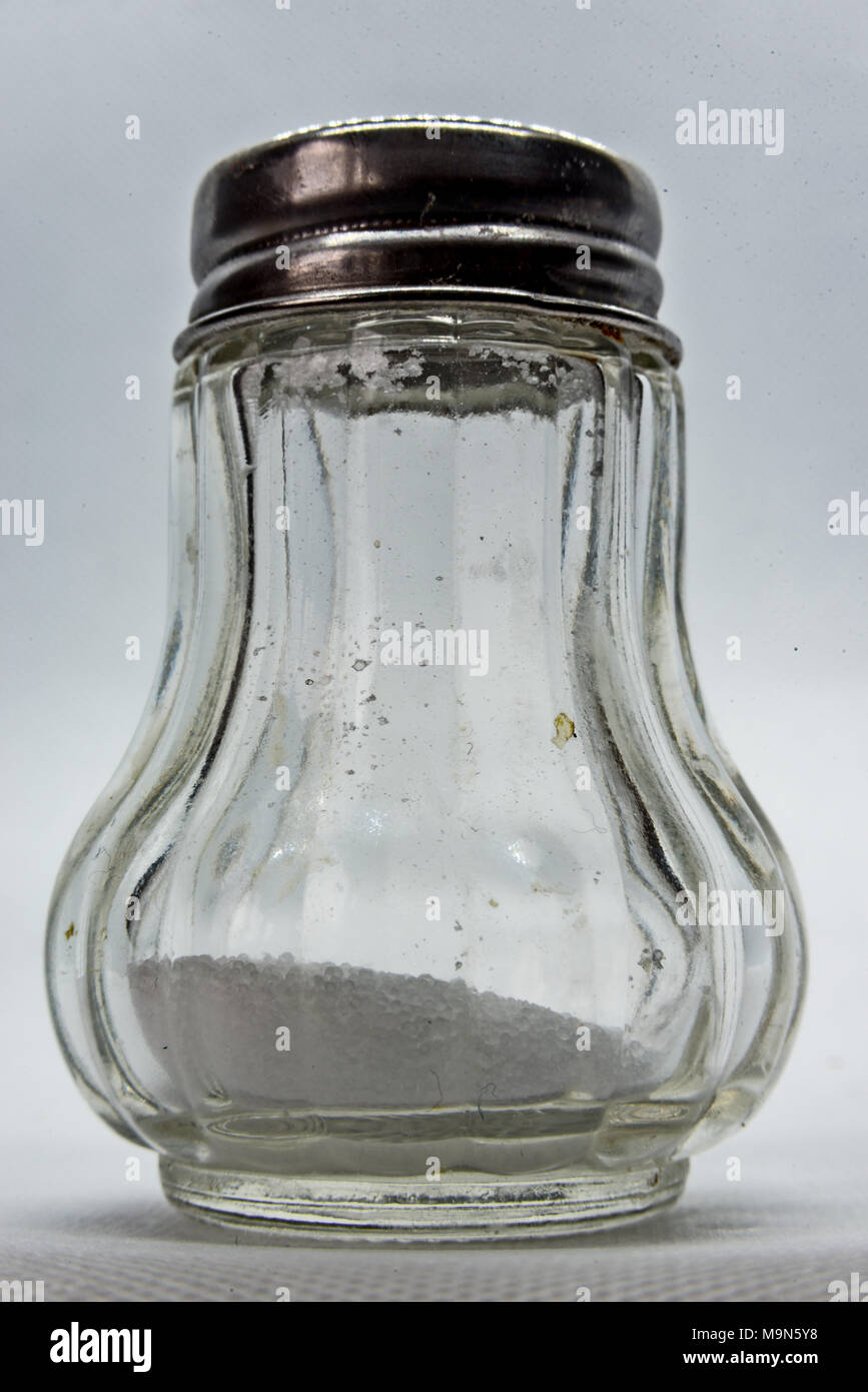 Salt shaker on white background Stock Photo - Alamy