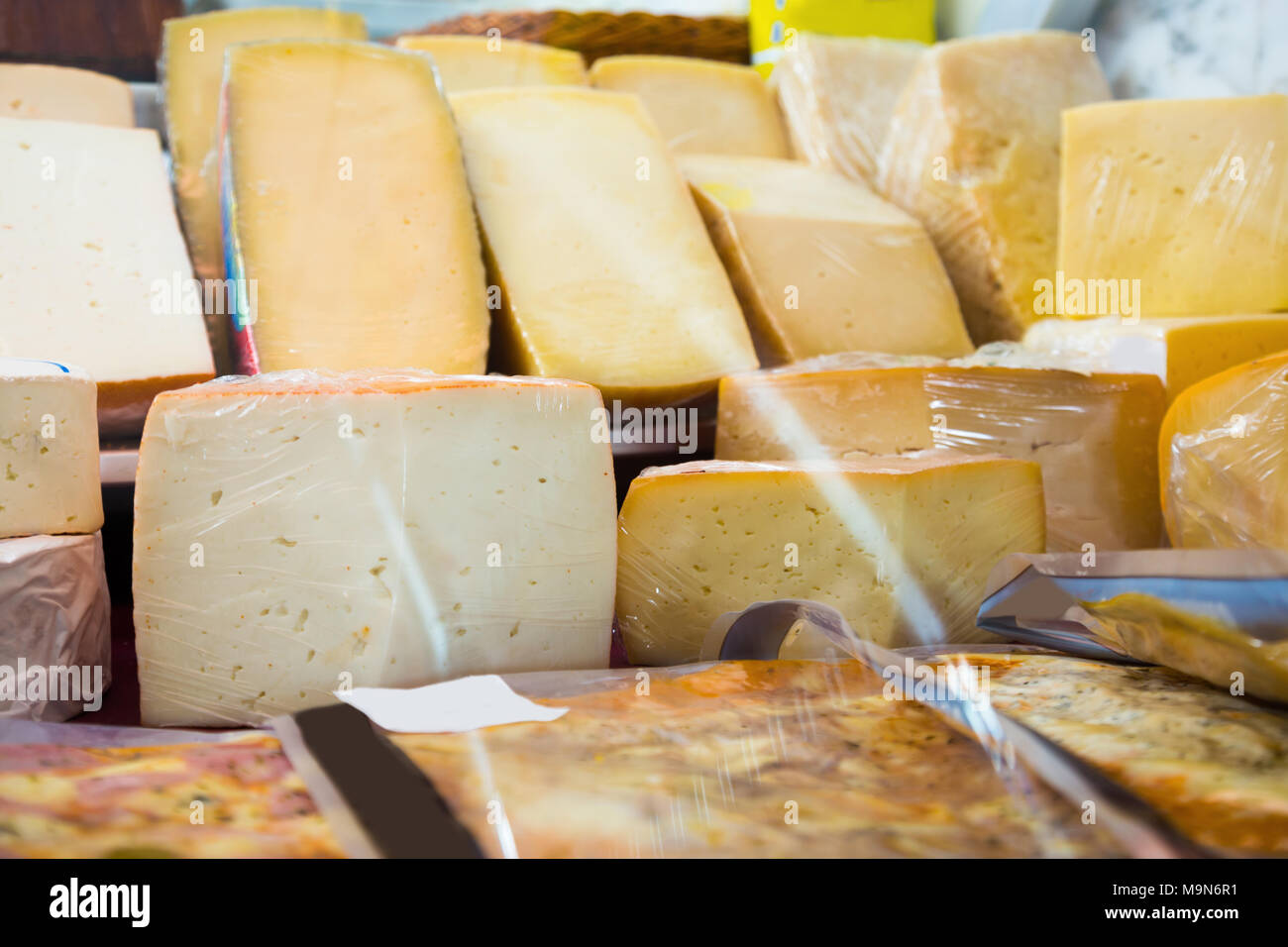 Cheese collection in grocery, close up shot Stock Photo - Alamy