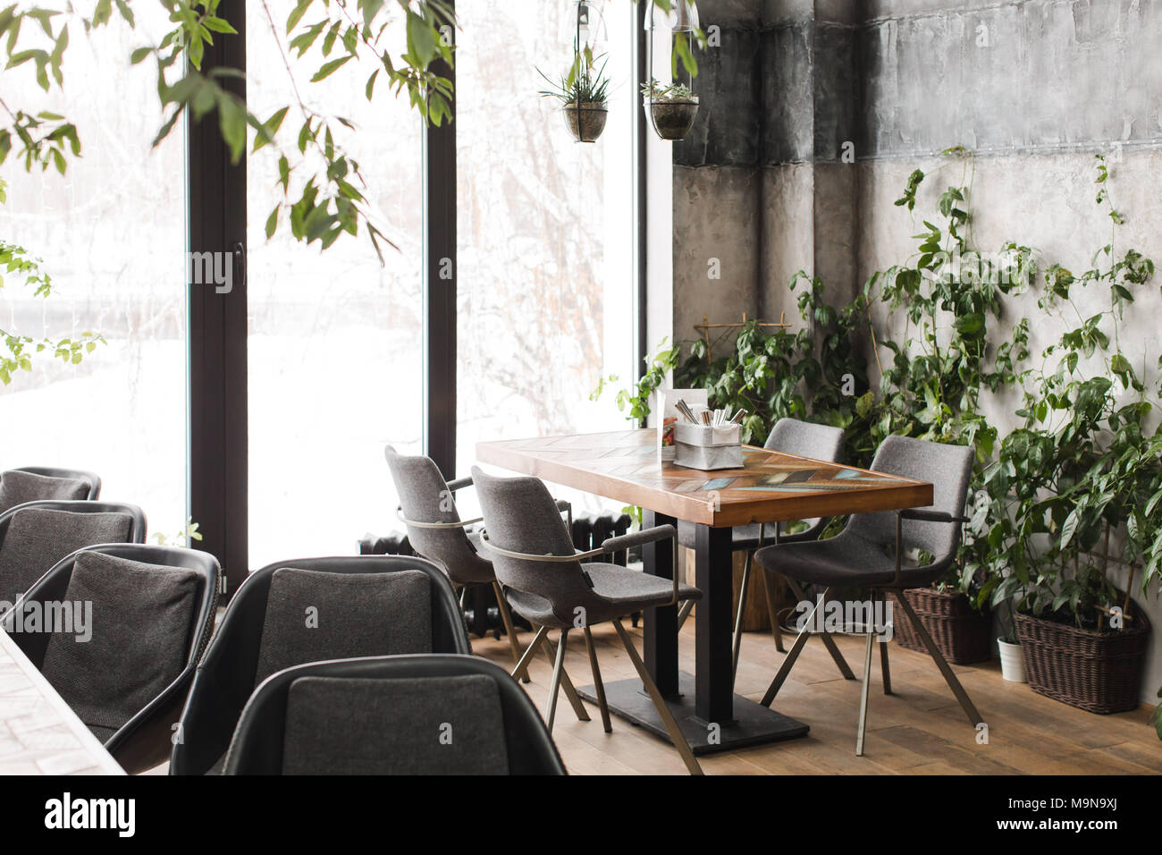 Interior of a stylish cafe in brown-gray tones Stock Photo - Alamy