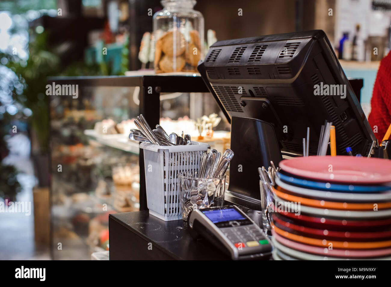 Cash desk and showcase with sweets in a cafe Stock Photo - Alamy