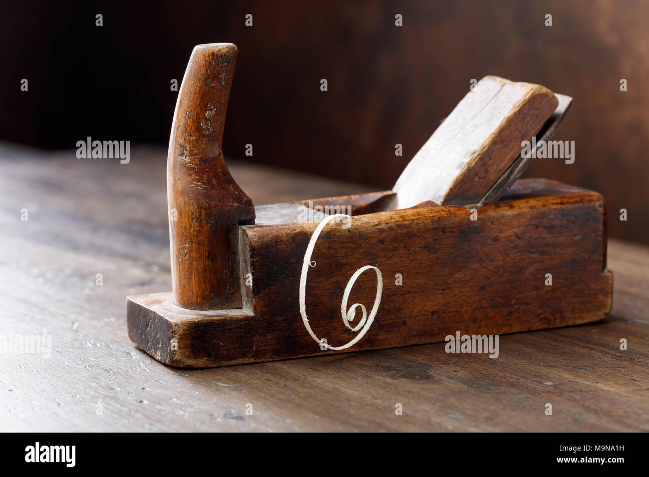 Old wooden planer on the table in the workshop Stock Photo - Alamy