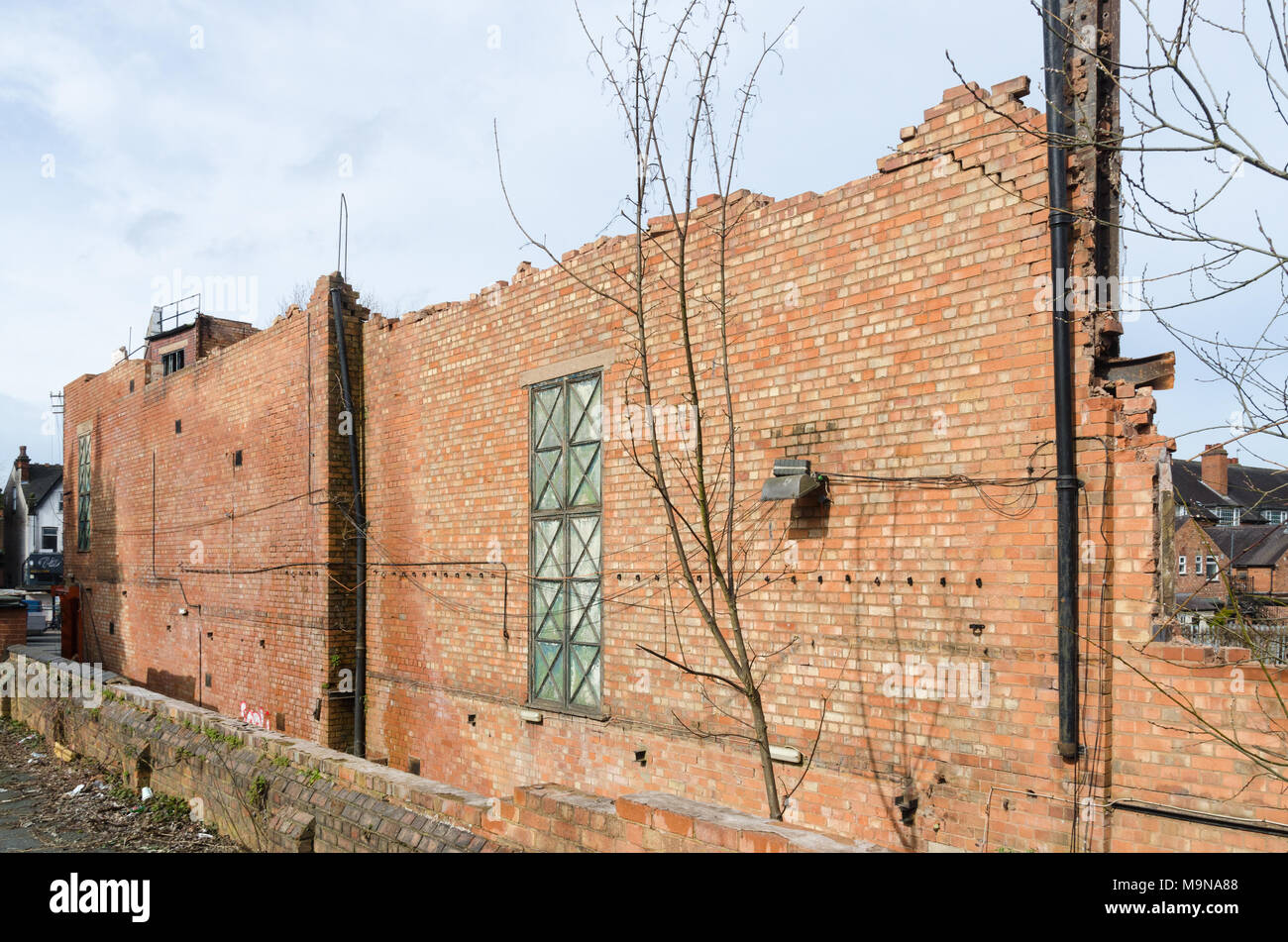 Part demolished red brick wall in Kings Heath, Birmingham Stock Photo ...