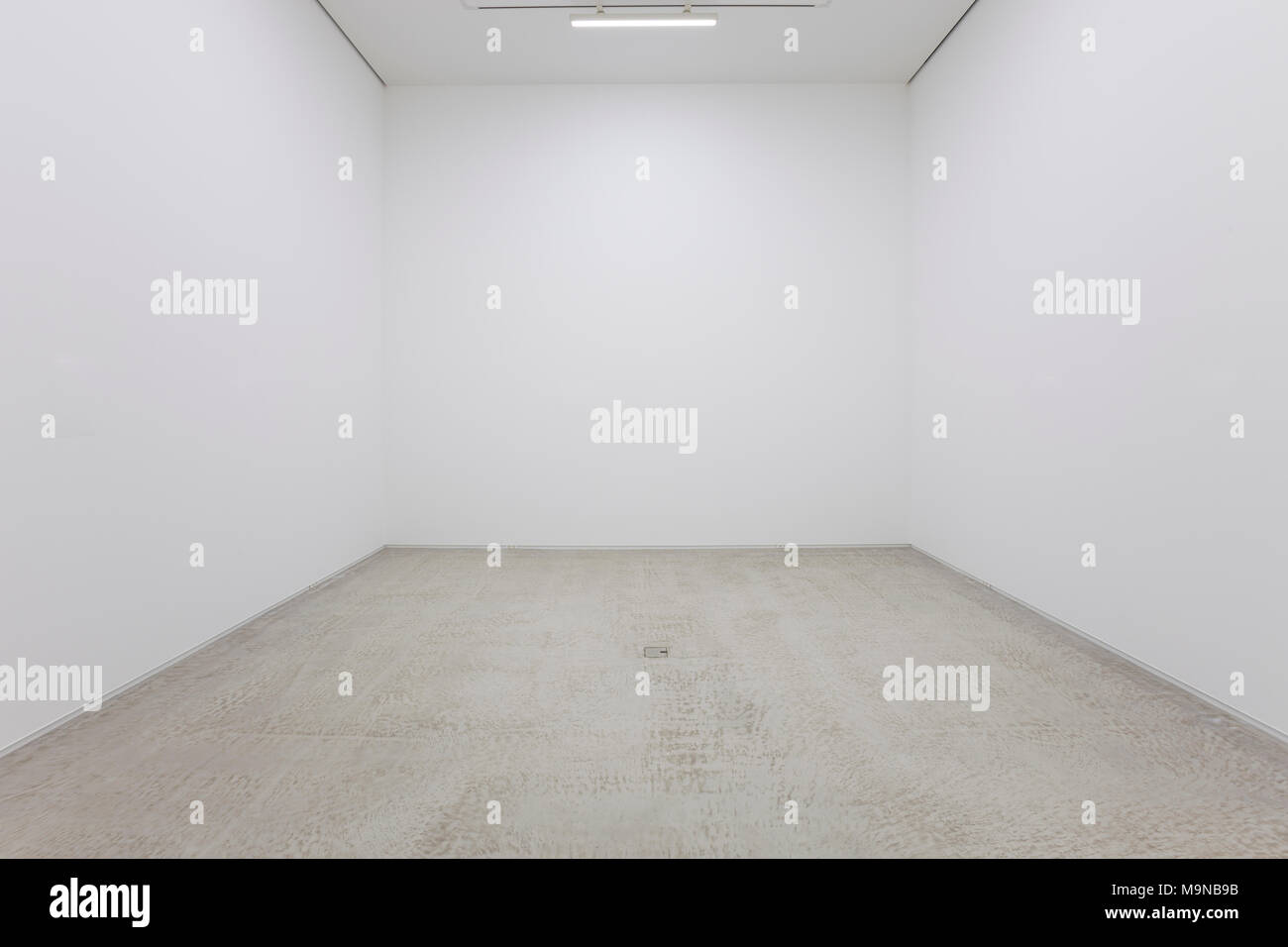 A view of a white painted interior of an empty room or an art gallery ...