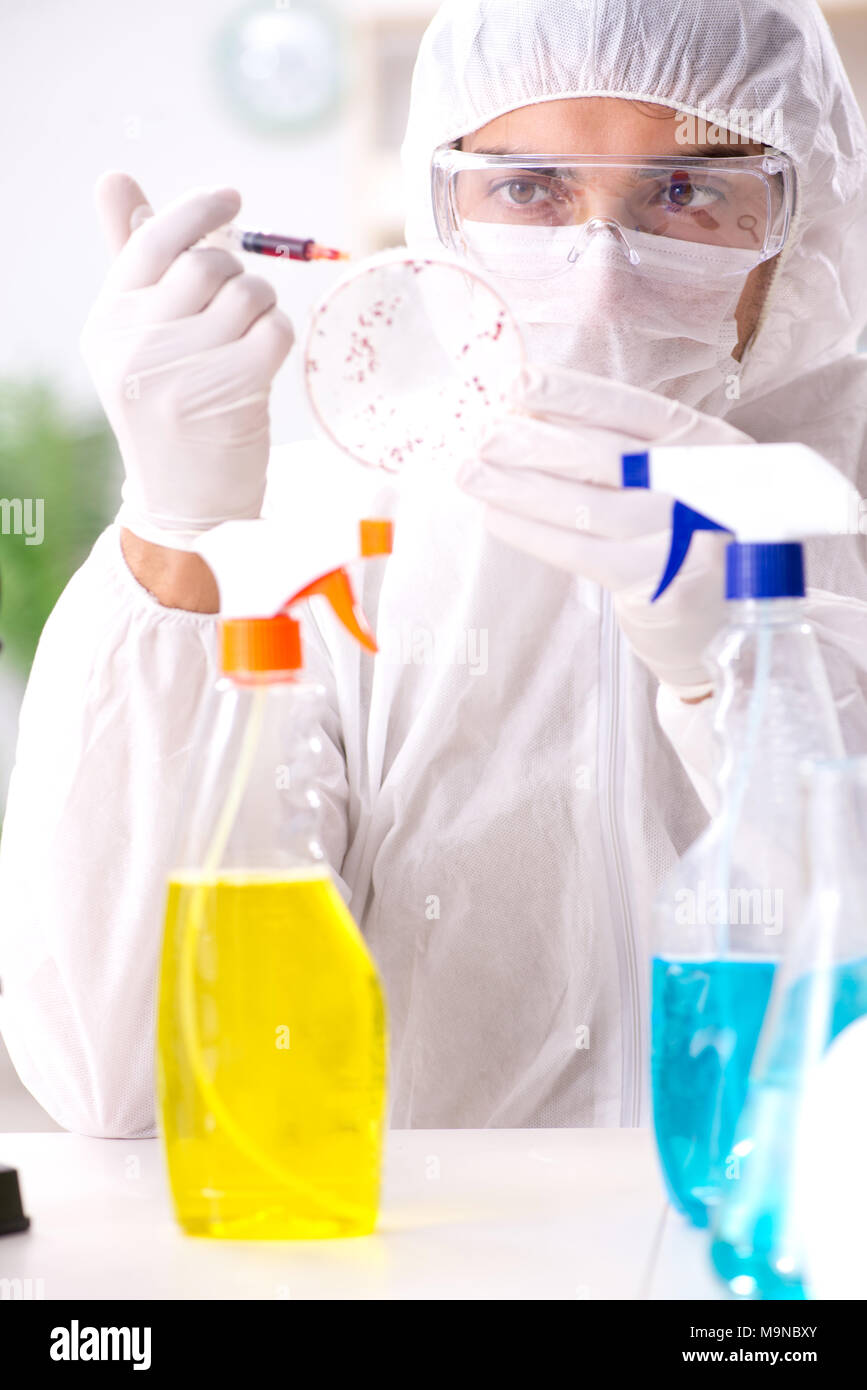 Chemist testing chemical substances in lab Stock Photo - Alamy