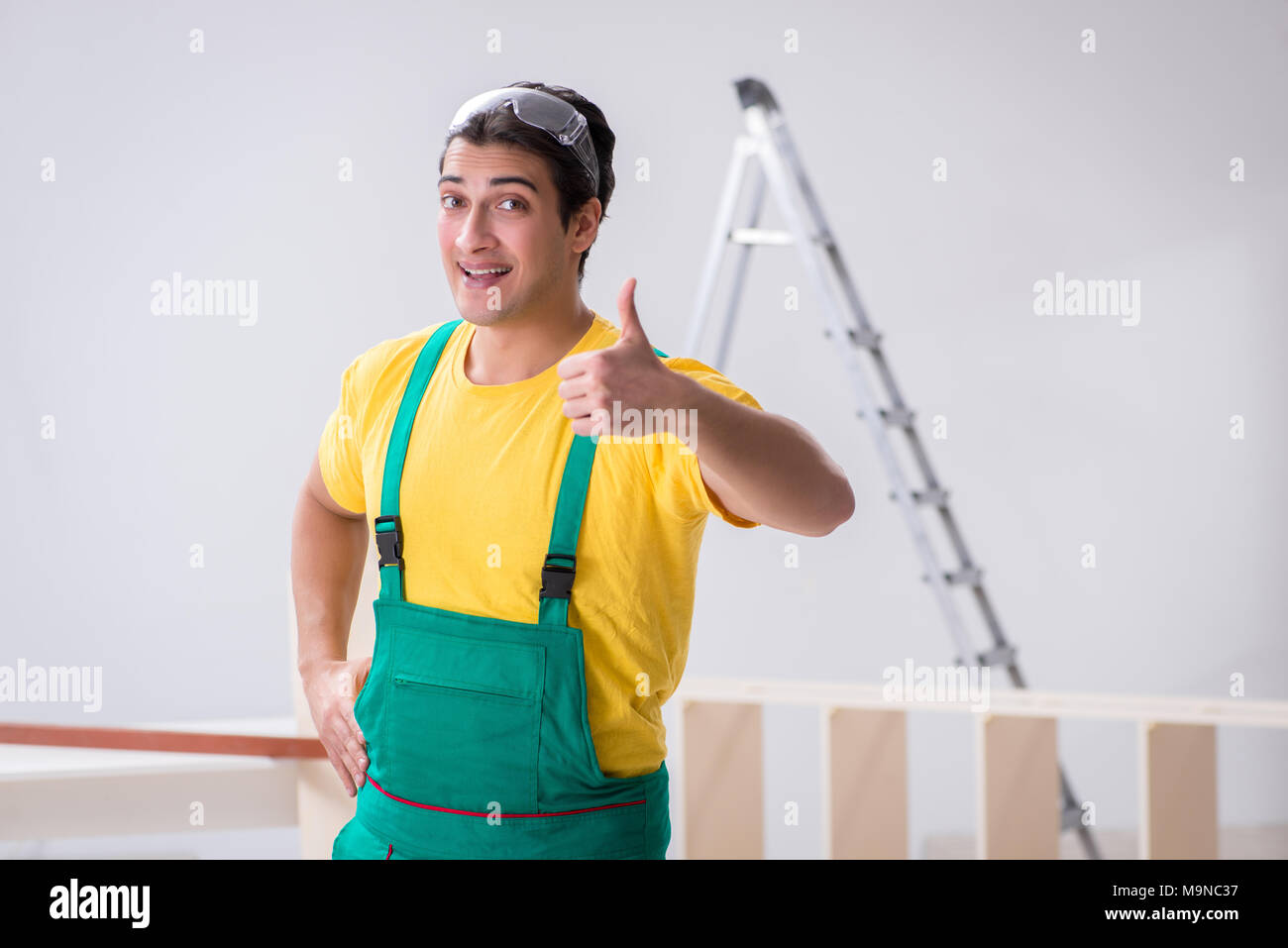 Construction worker working on contractor site Stock Photo - Alamy