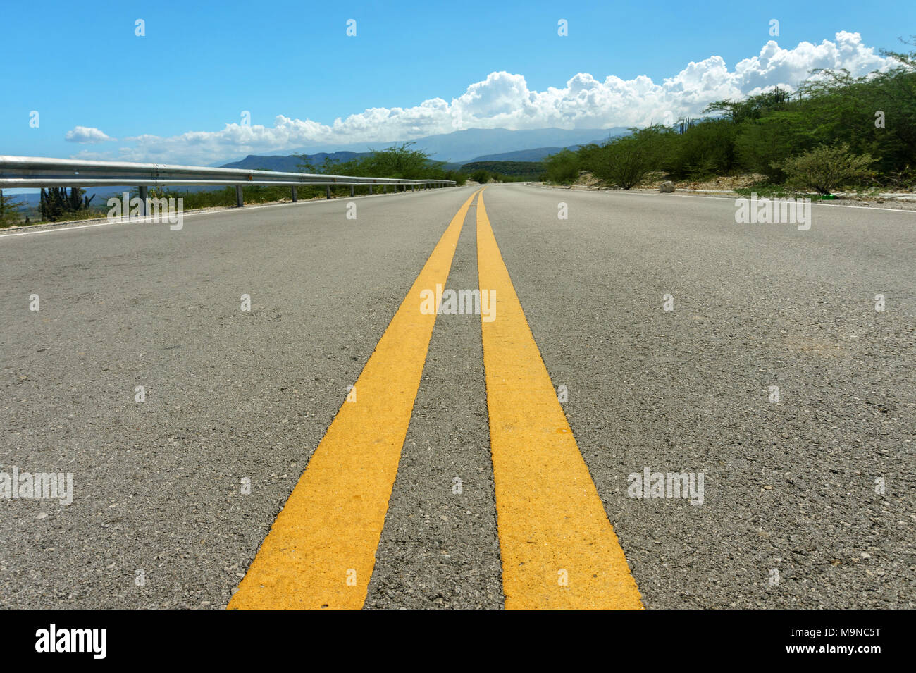 two yellow dividing strips on asphalt road. Speed highway Stock Photo ...