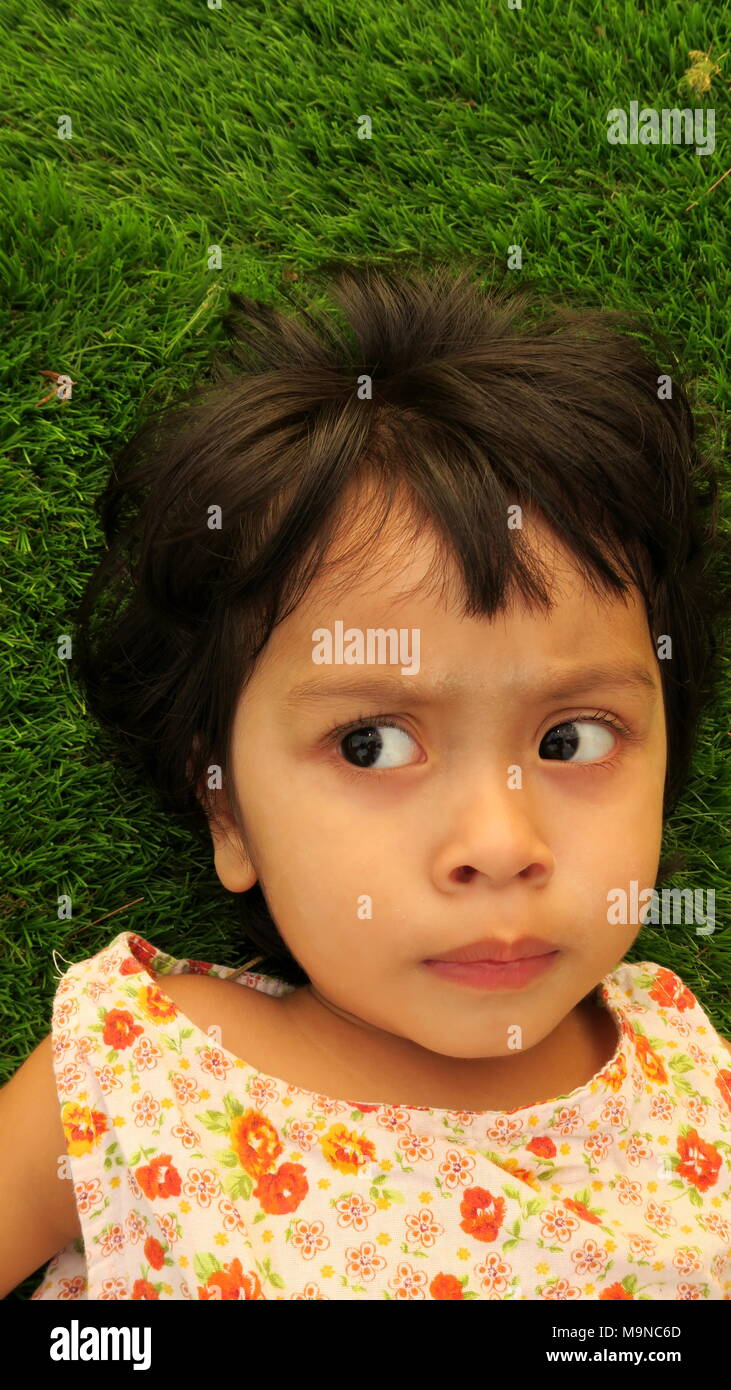 Curiosity face little cute girl Stock Photo - Alamy