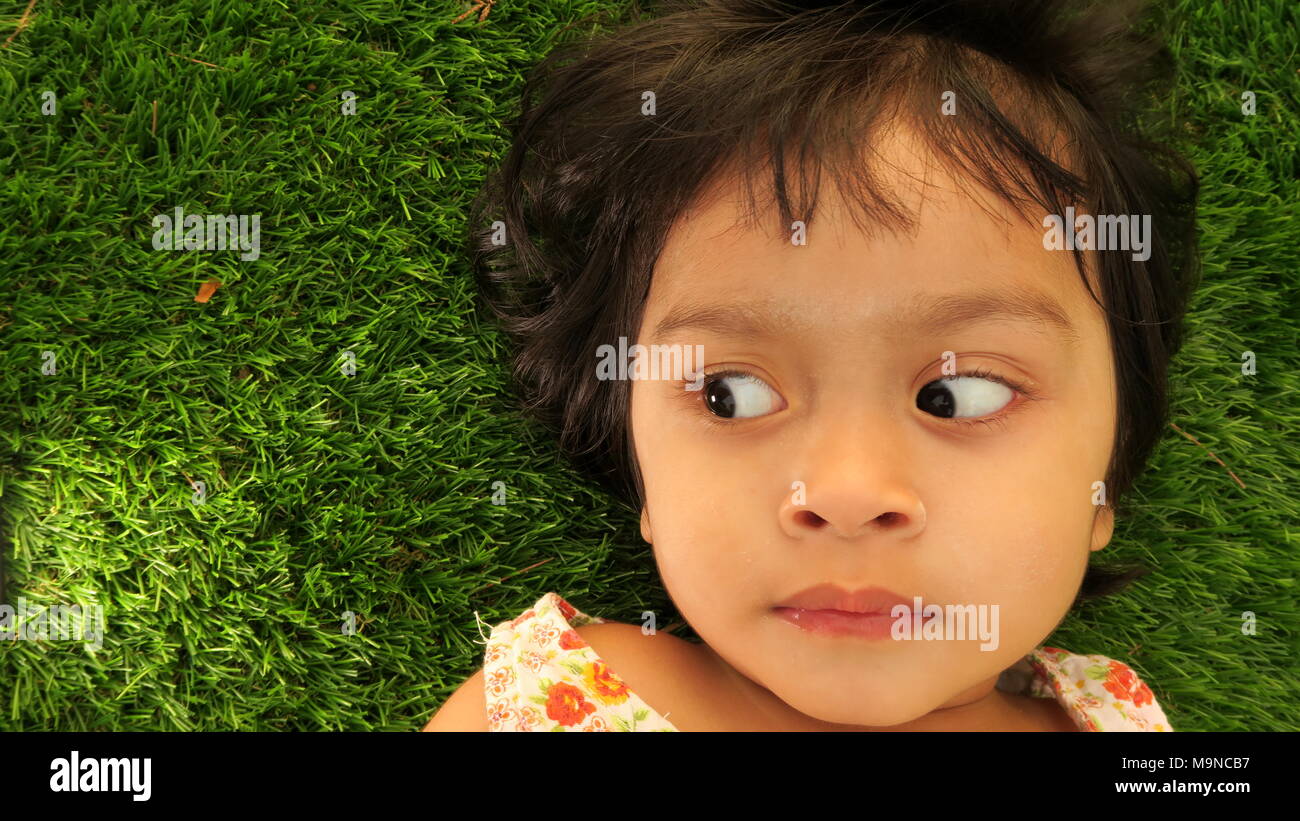 Curiosity face little cute girl Stock Photo - Alamy