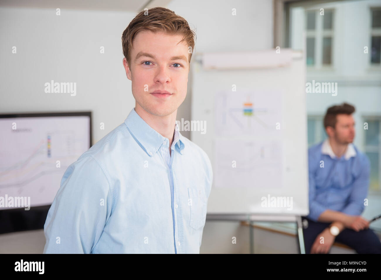 Confident Male Professional Standing In Office Stock Photo - Alamy