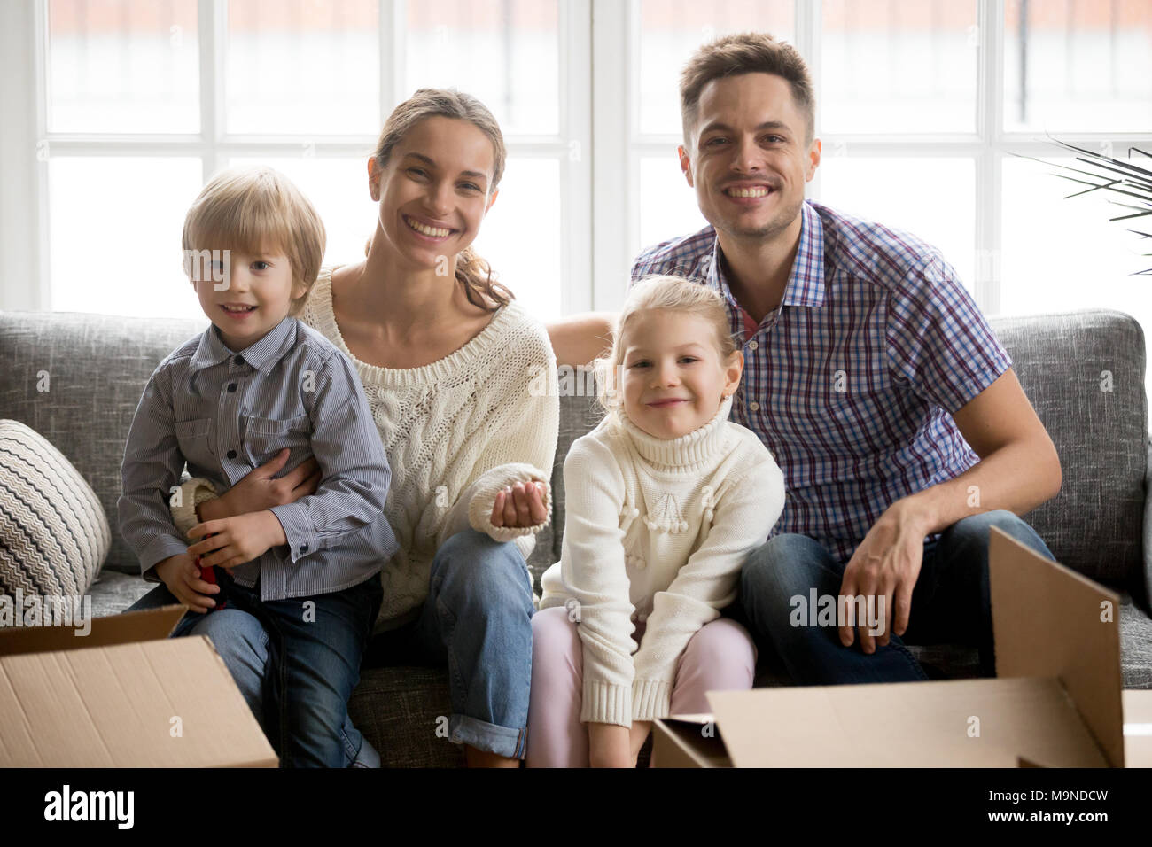 Kids adoption kid with new parents hi-res stock photography and images ...