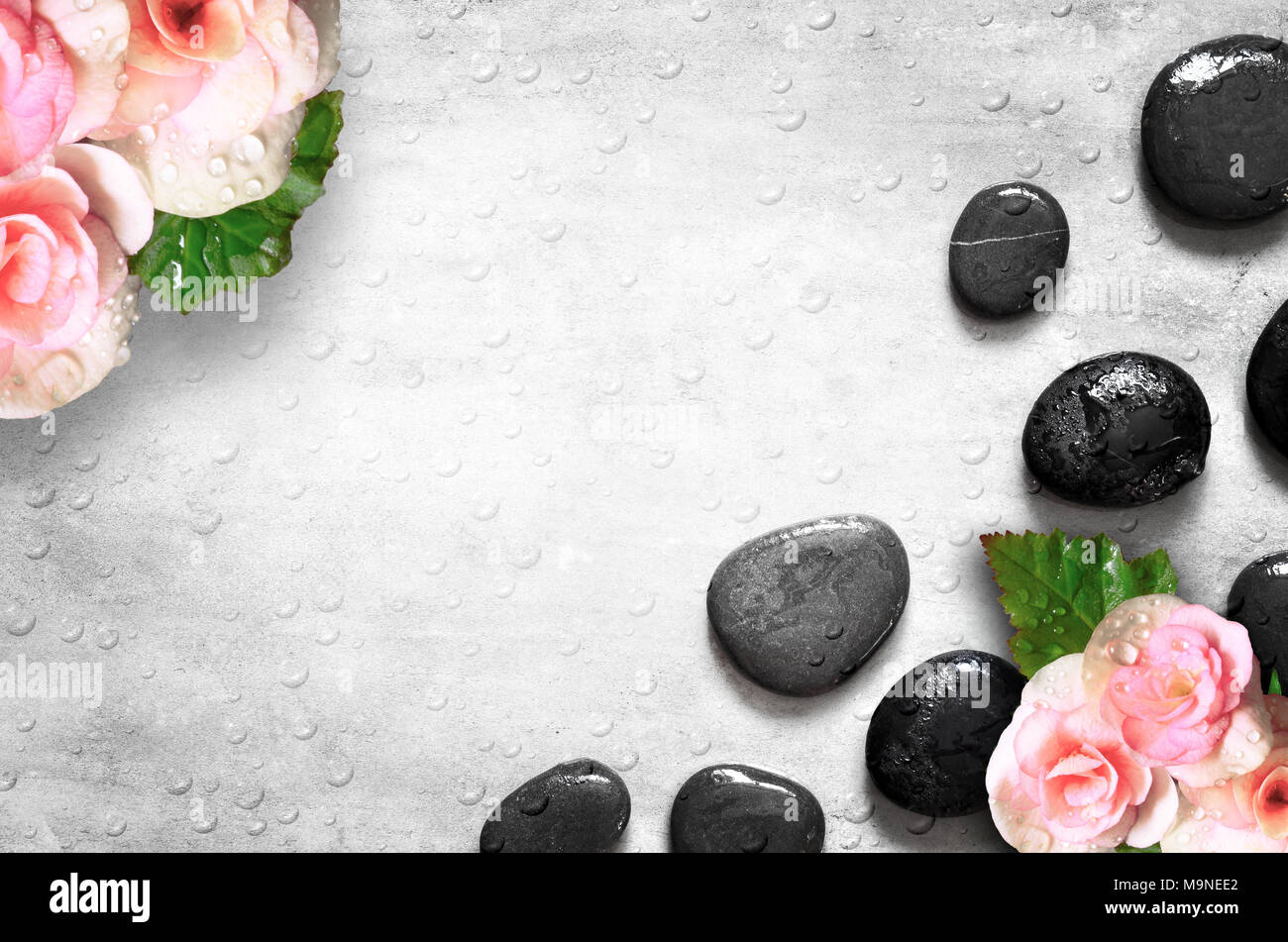 Set of pink rose flowers on pebble. Spa concept Stock Photo - Alamy