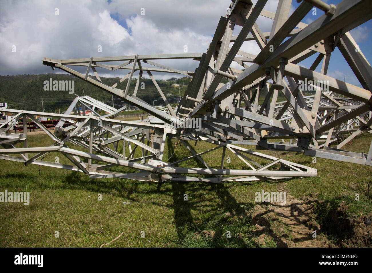 Storm-damaged lattice towers rest at the laydown yard while awaiting ...