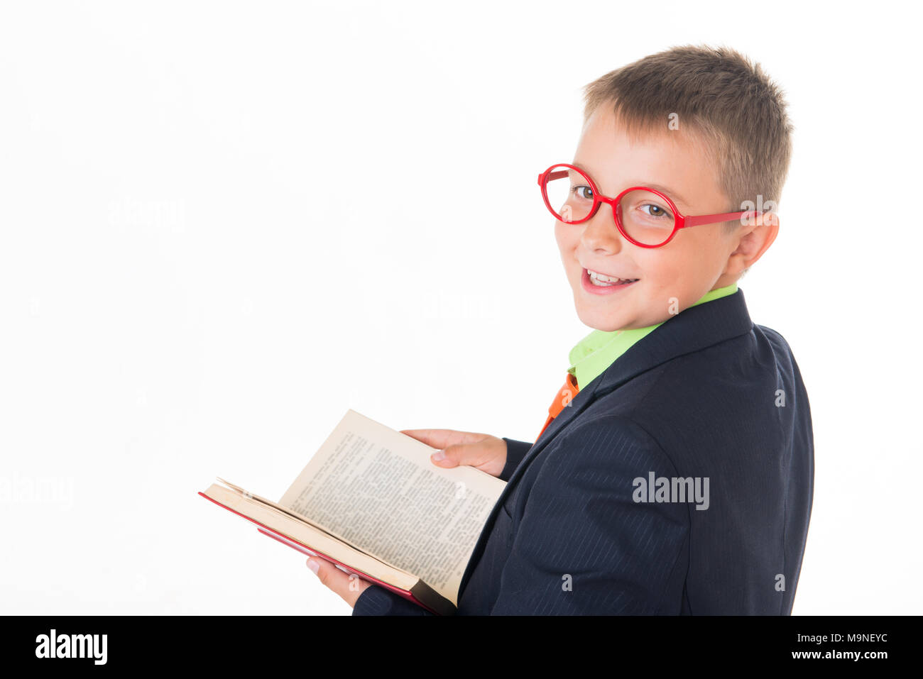 Boy reading a book thirsty for knowledge - isolated over a white ...