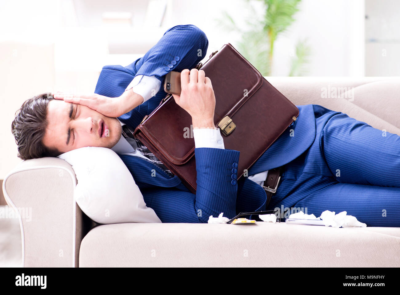 Sick employee staying at home suffering from flue Stock Photo - Alamy