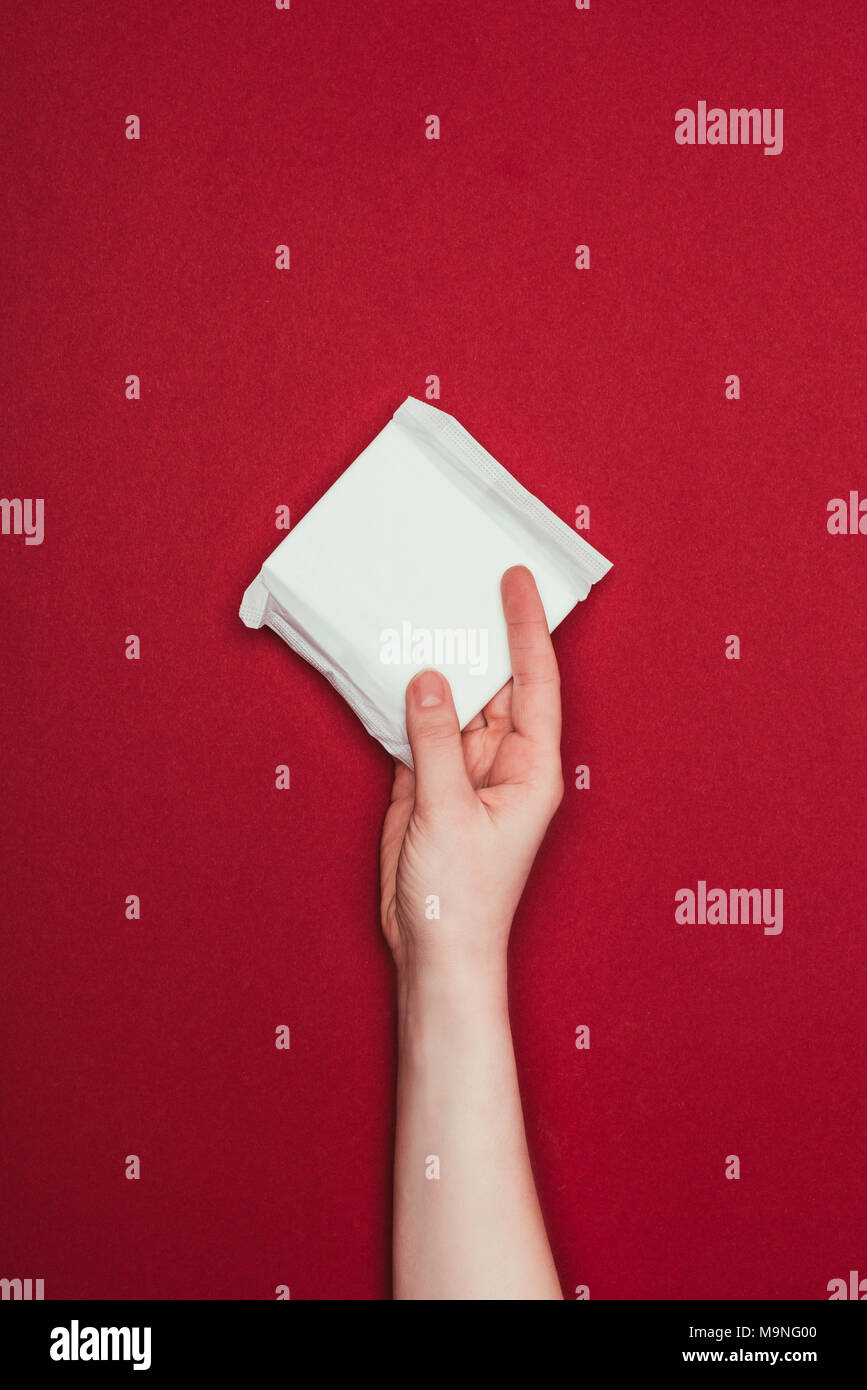 Woman holding period pad hi-res stock photography and images - Alamy