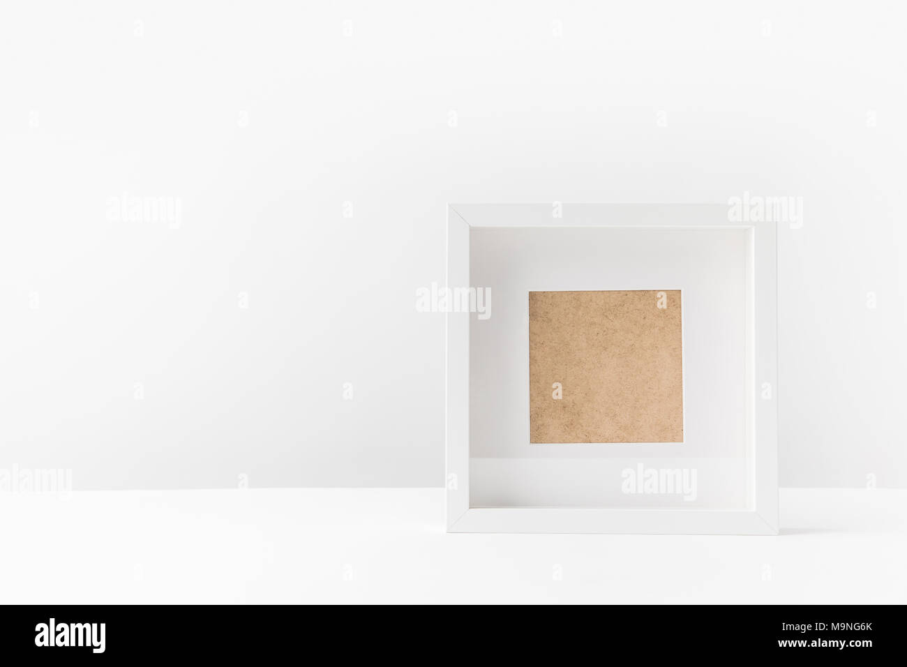 close-up view of empty white photo frame on white Stock Photo - Alamy
