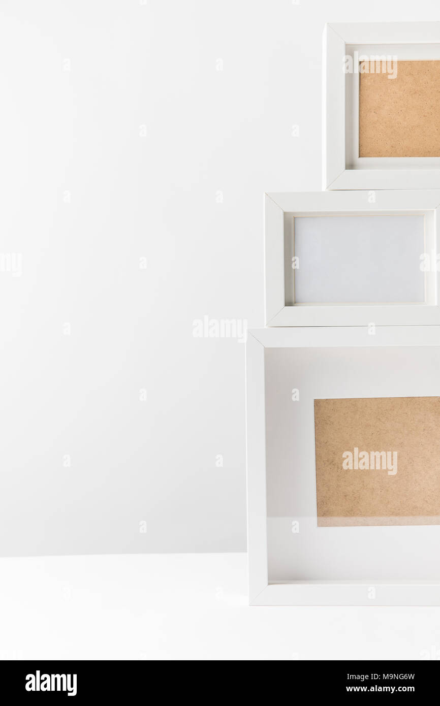 close-up view of empty white photo frames on white Stock Photo - Alamy