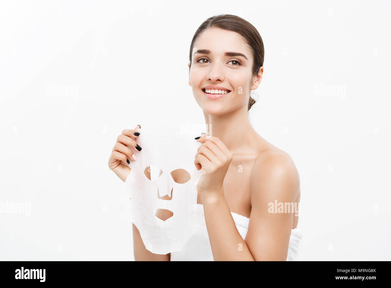 Beauty Skin Care Concept - Beautiful Caucasian Woman applying paper ...