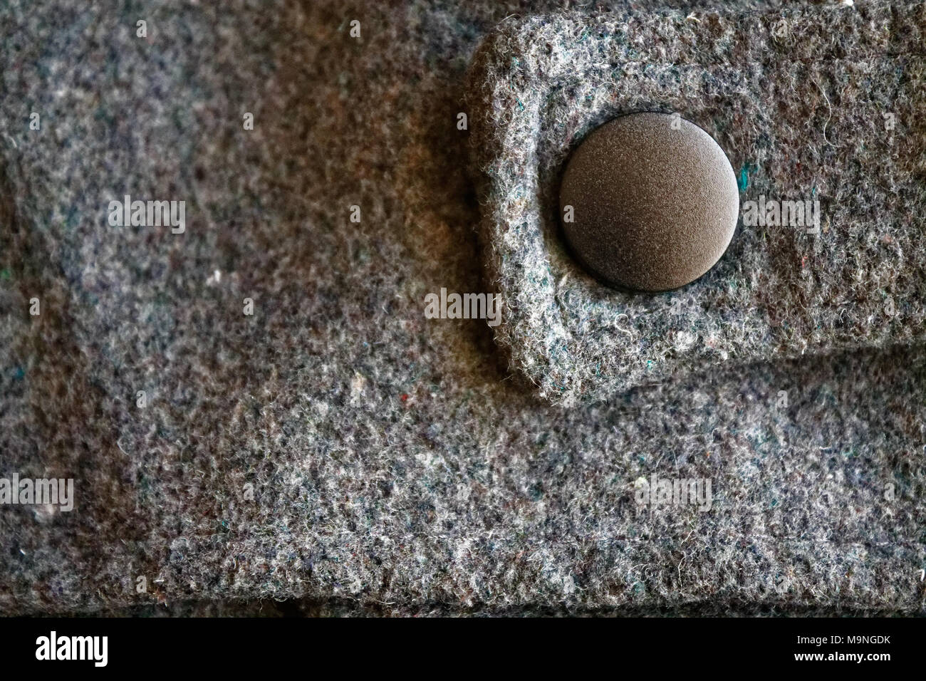 Gray felt with button macro texture for background Stock Photo - Alamy