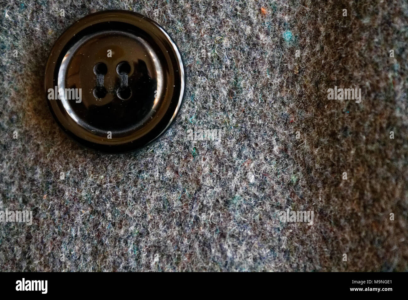 Gray felt with button macro texture for background Stock Photo - Alamy