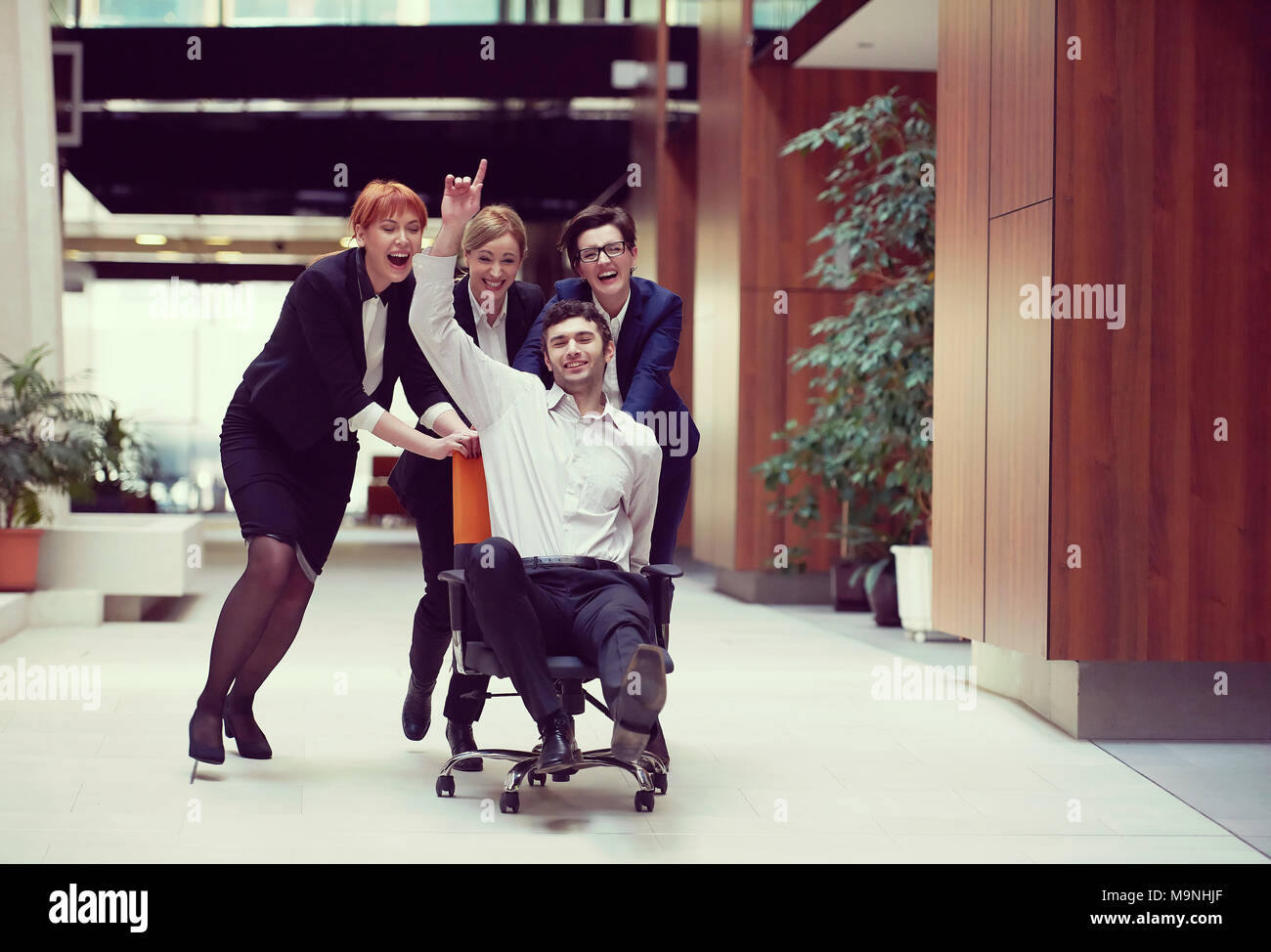 business people group at modern office indoors have fun and push office ...