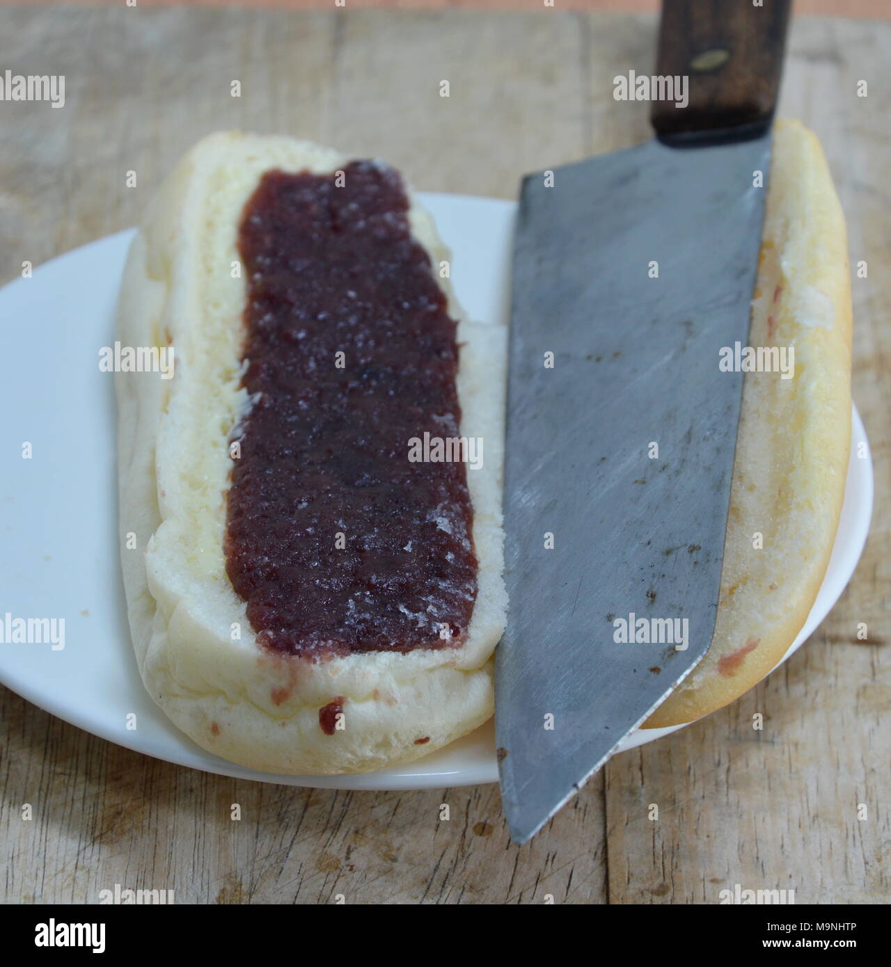 bread filling mashed red bean on wooden chop block Stock Photo - Alamy