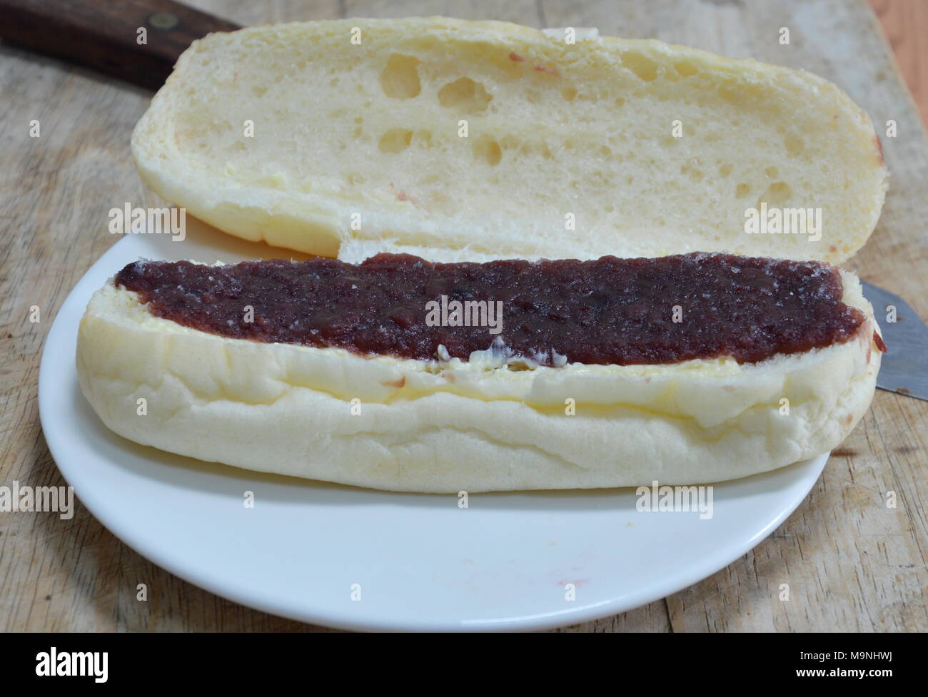 bread filling mashed red bean on wooden chop block Stock Photo - Alamy