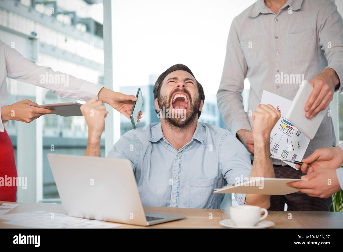 Composite image of colleagues standing by frustrated businessman at ...
