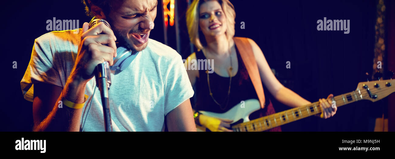 Band performing on stage Stock Photo - Alamy