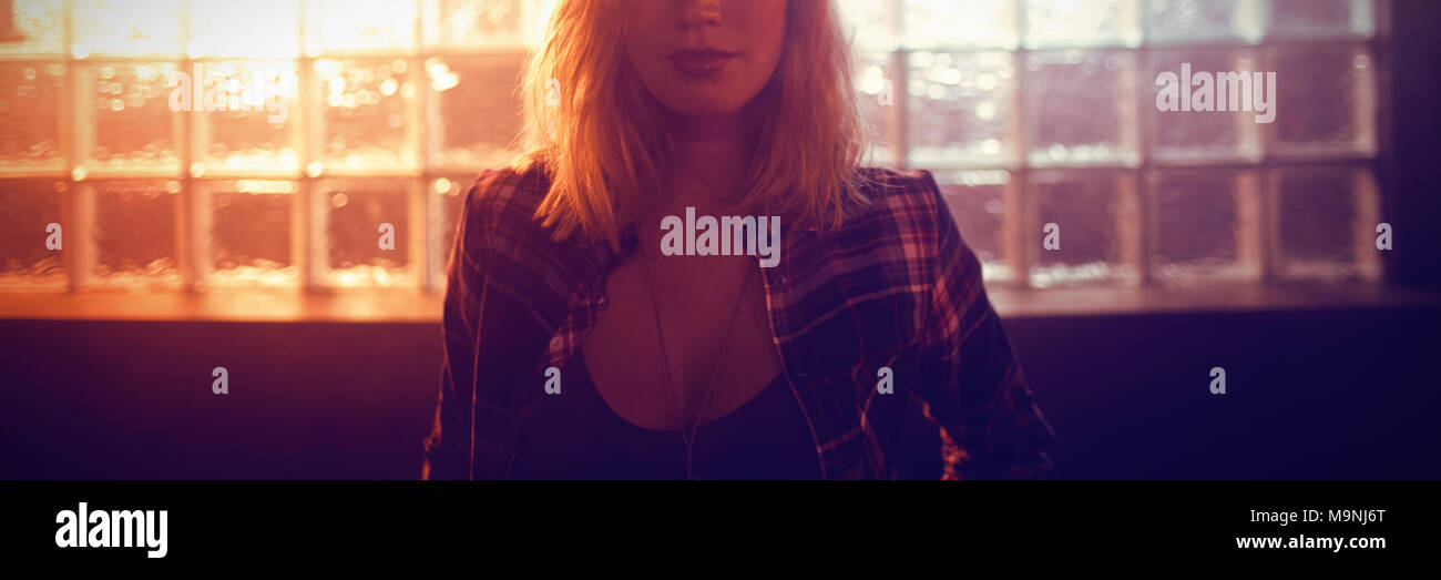 Female singer standing at club Stock Photo - Alamy