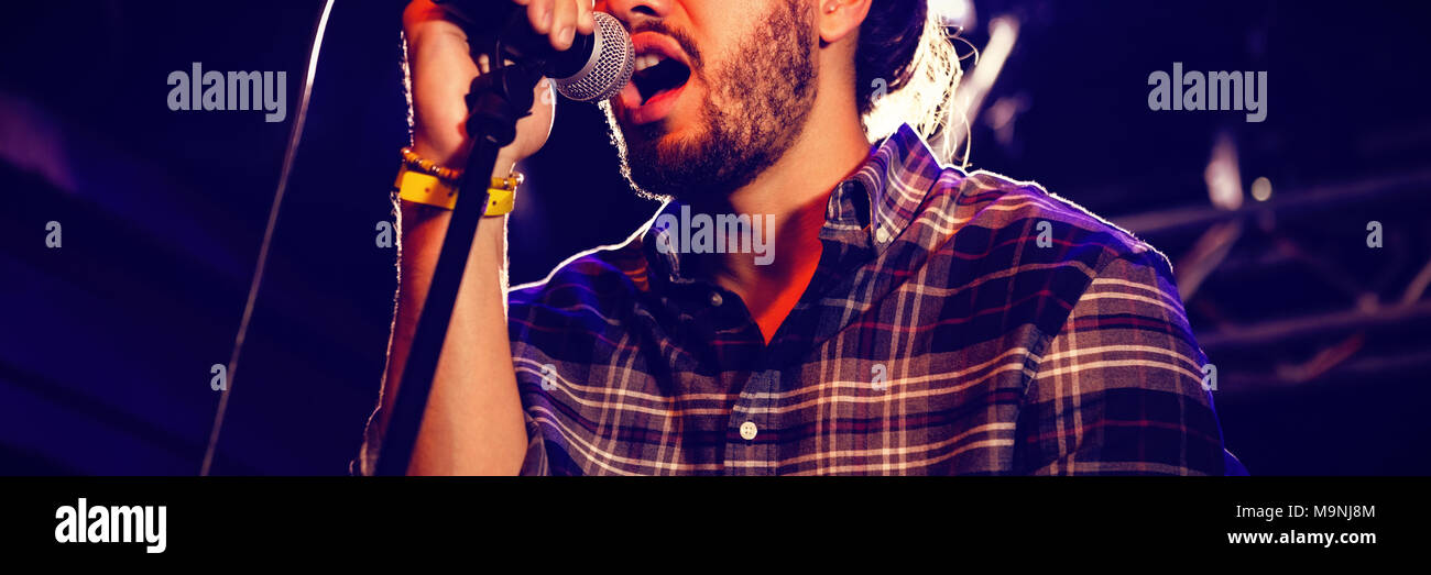 Male singer performing in nightclub Stock Photo - Alamy