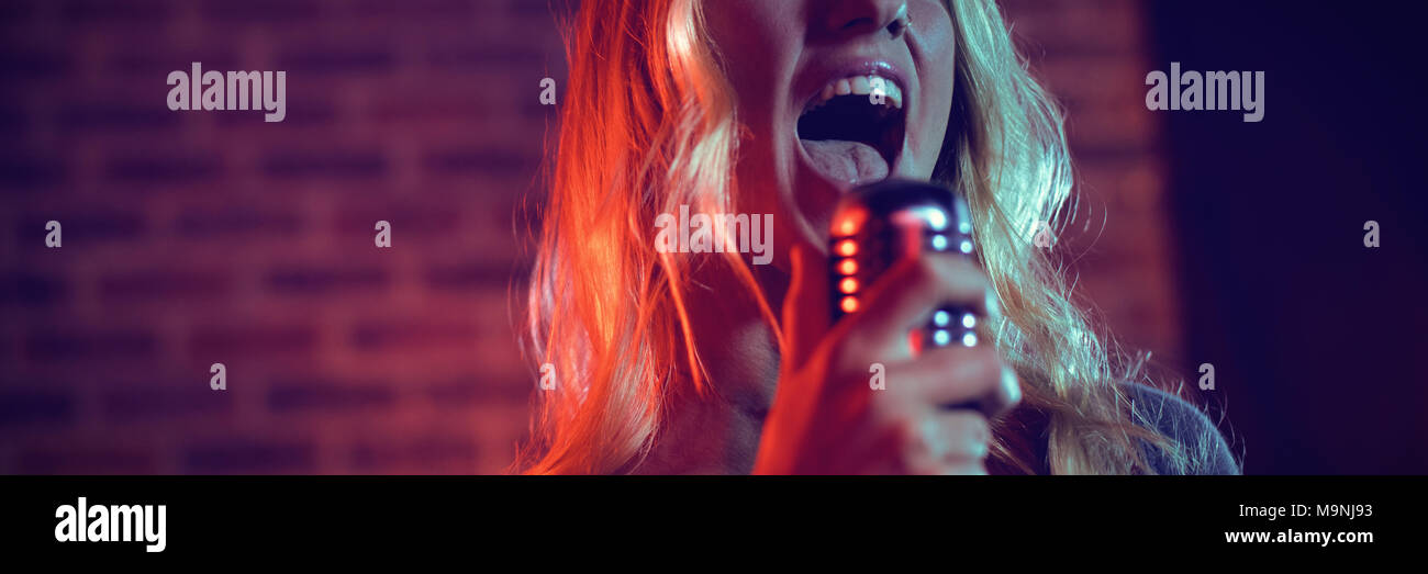 Singer performing at music concert Stock Photo - Alamy