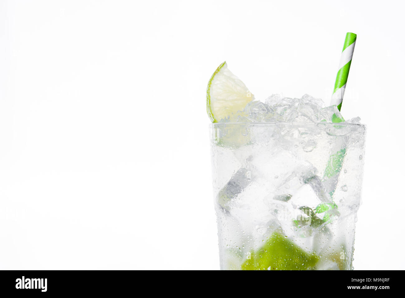 Caipirinha cocktail in glass on white background Stock Photo - Alamy