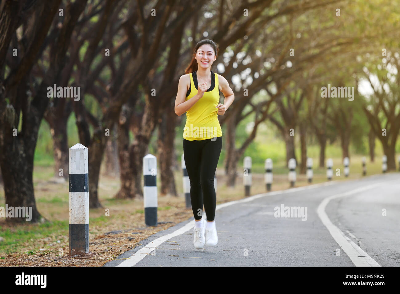 beautiful fitness woman running in the park Stock Photo - Alamy