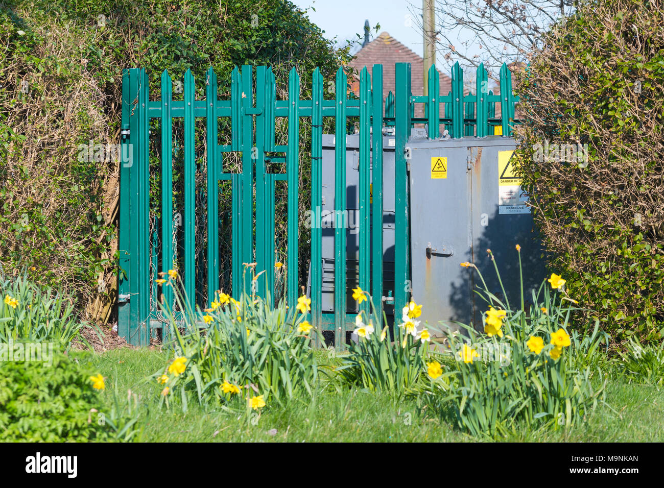Small electricity substation fenced off in a residential area in the UK ...