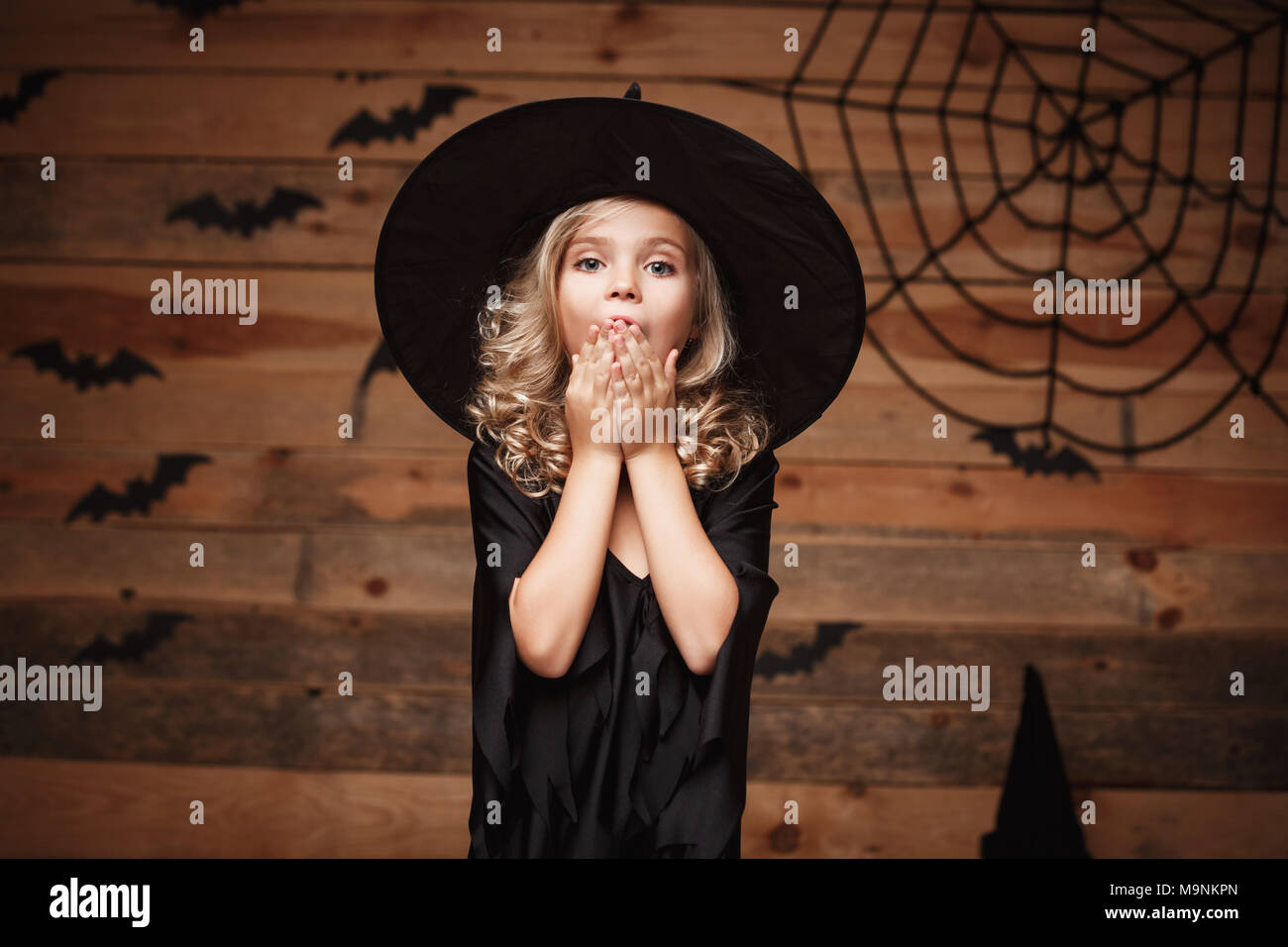 Halloween Witch concept - closeup shot of little caucasian witch child ...