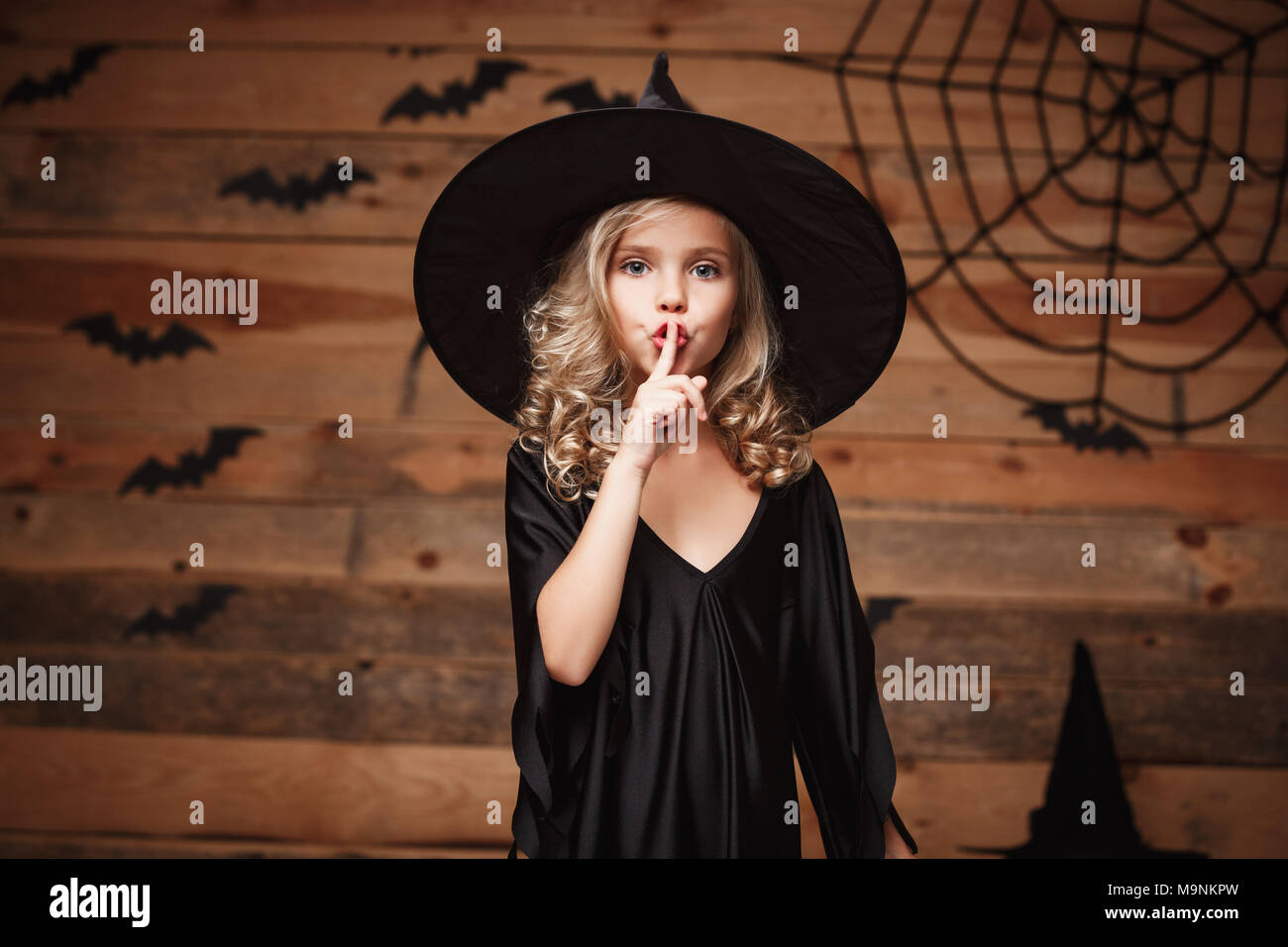 Halloween Witch concept - closeup shot of little caucasian witch child ...