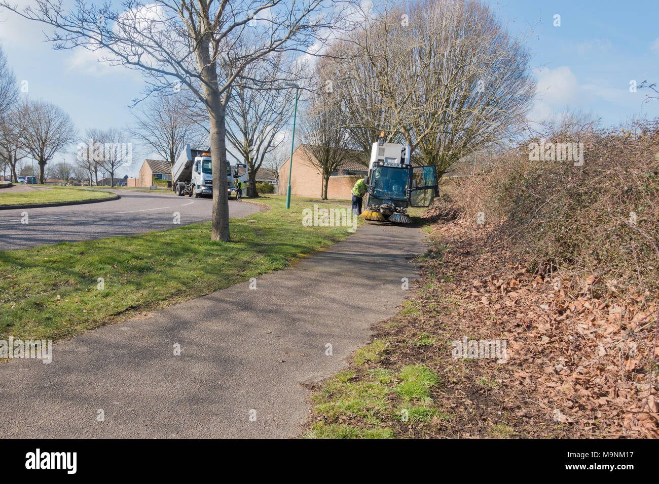 Local council road sweepers at work on a suburban streetDorset, United ...
