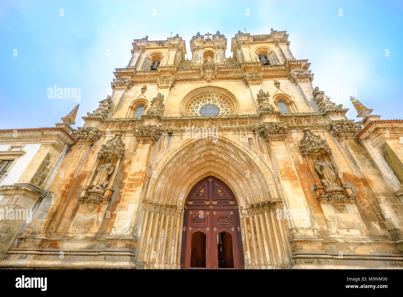 Bottom view of main gate of Roman Gothic Monastery of Alcobaca or ...