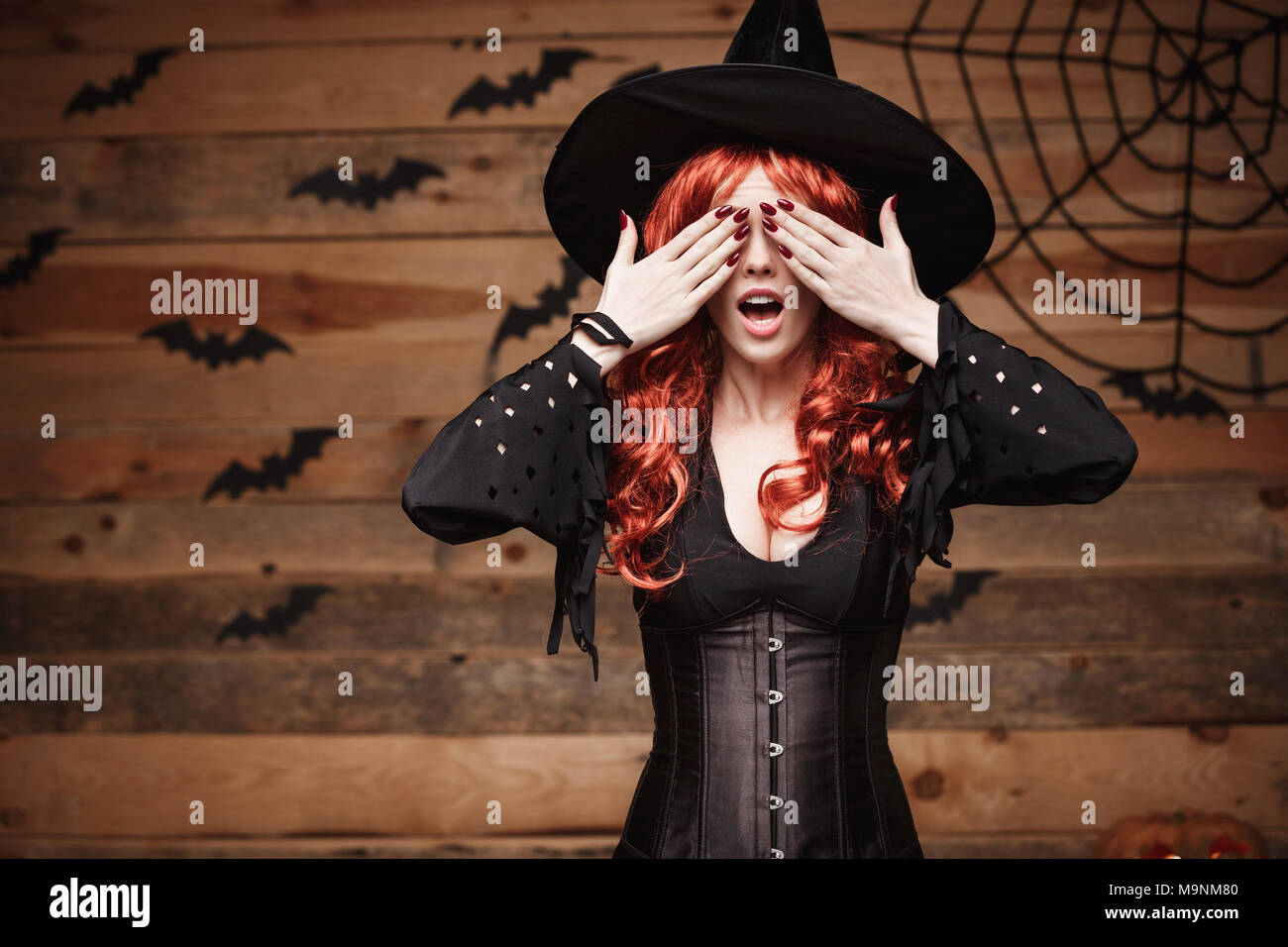 Halloween witch concept - Happy Halloween red hair Witch holding hands ...