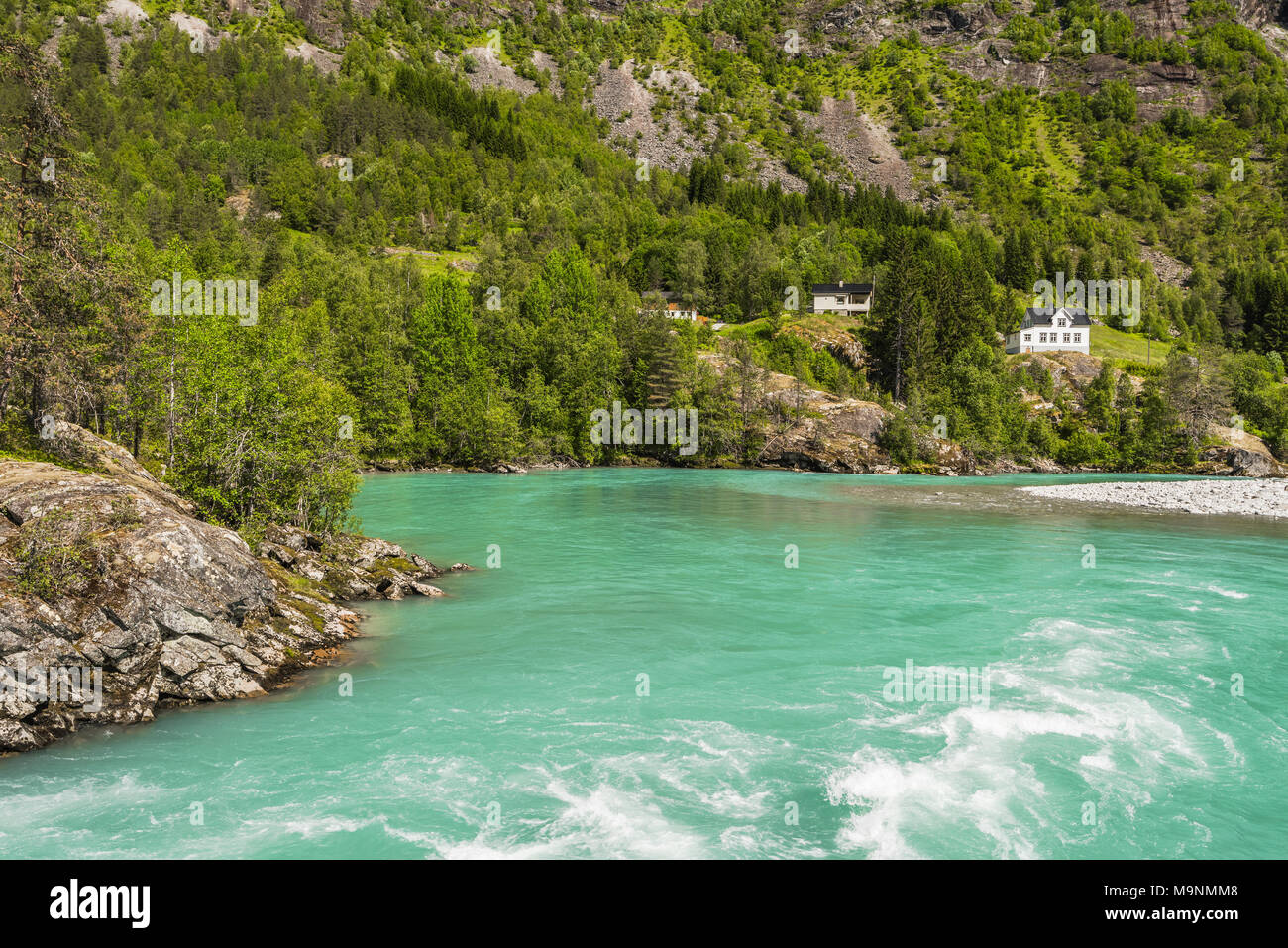 river in the valley Jostedalen, near Gaupne, Norway, turquoise water of ...