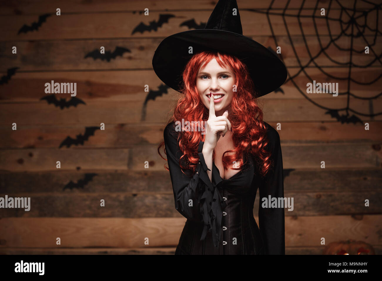 Halloween witch concept - Happy Halloween red hair Witch doing silence ...