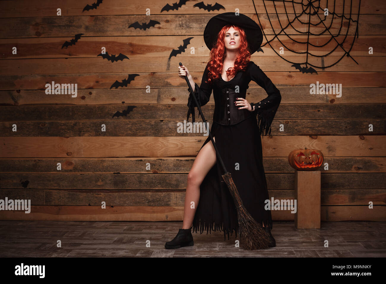 Halloween witch concept - Full-length Happy Halloween red hair Witch ...