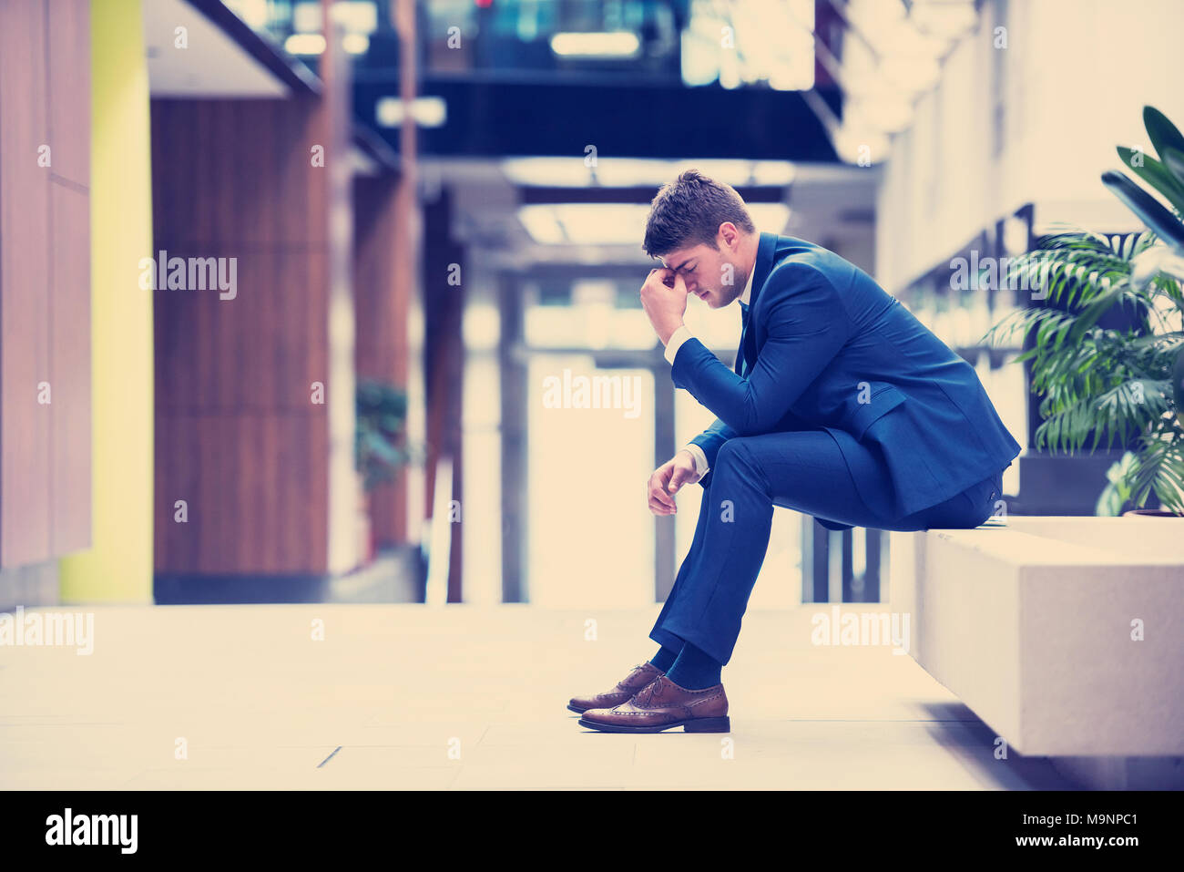 frustrated young business man working on laptop computer at office ...