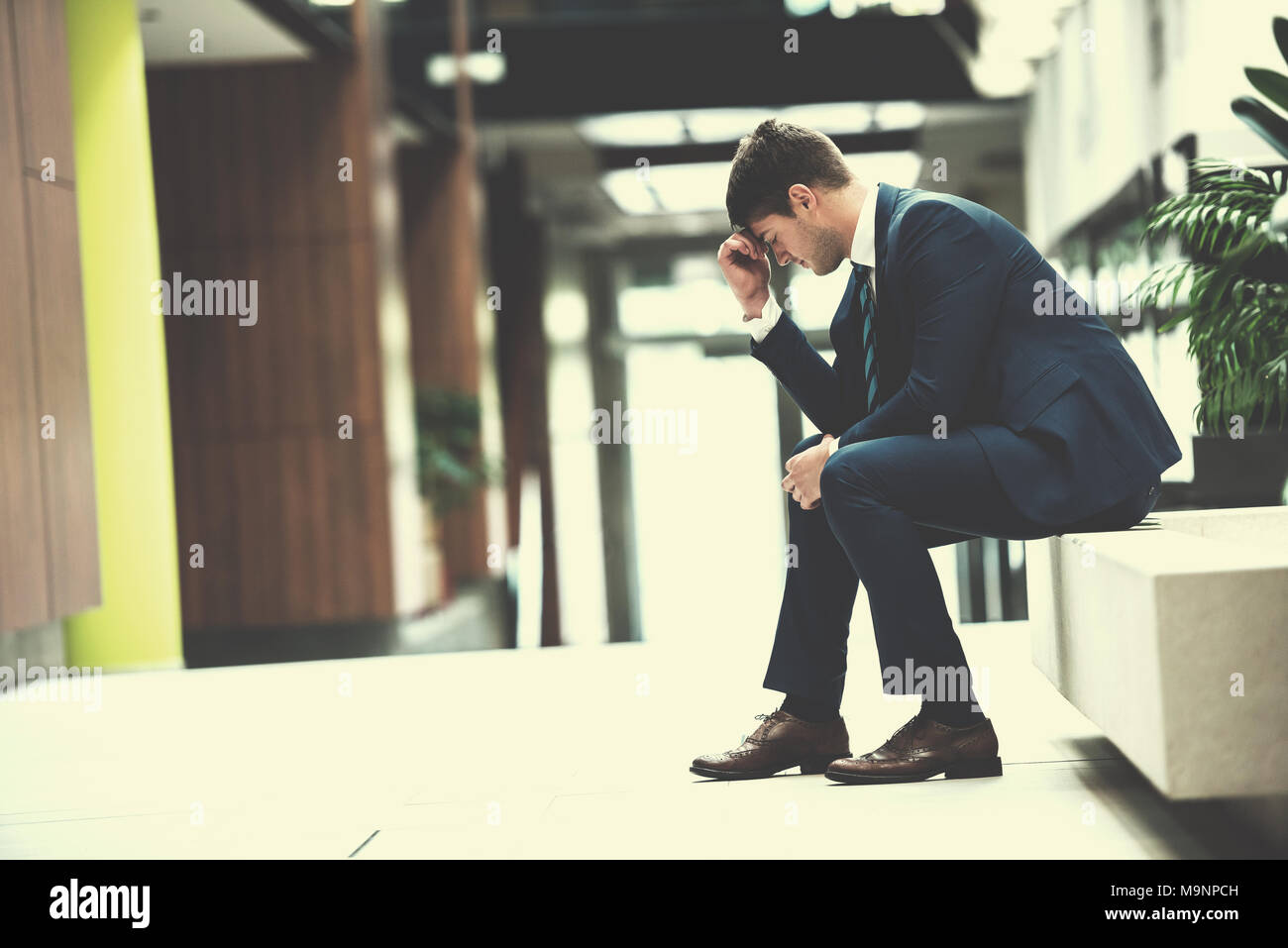 frustrated young business man working on laptop computer at office ...