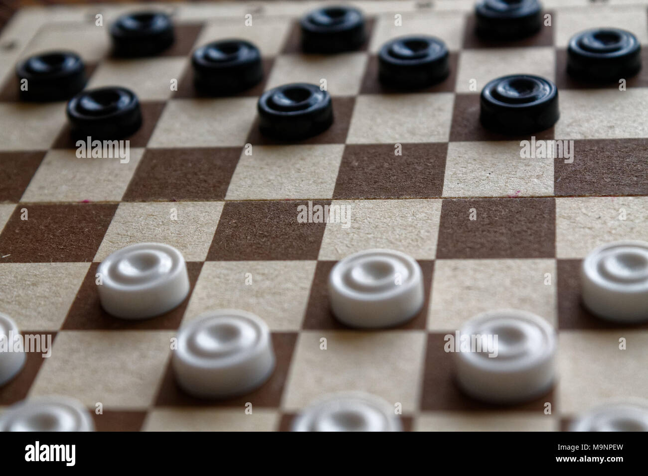 Checkers in checkerboard ready for playing. Game concept. Board game ...