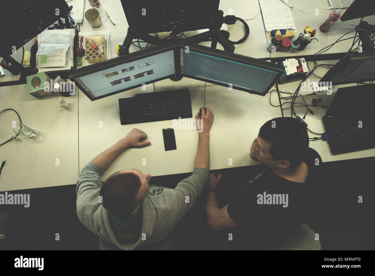 Top View Of Software Developers Writing Programming Code On Computer 7255