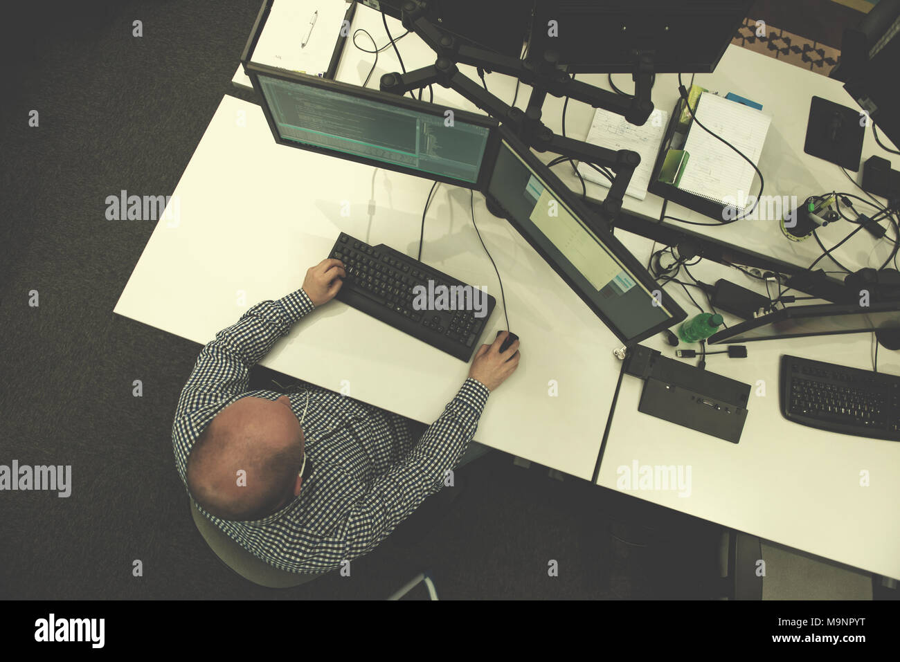 top view of software developer writing programming code on computer ...