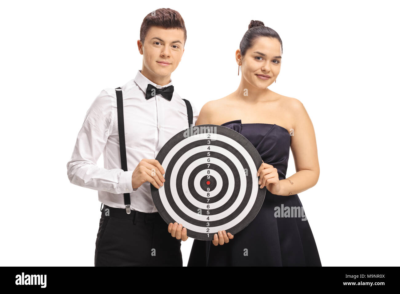 Elegantly dressed teenage couple holding a target isolated on white ...